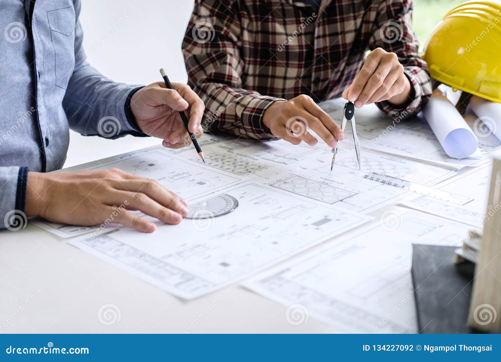 Construction Engineering or Architect Discuss a Blueprint while ...