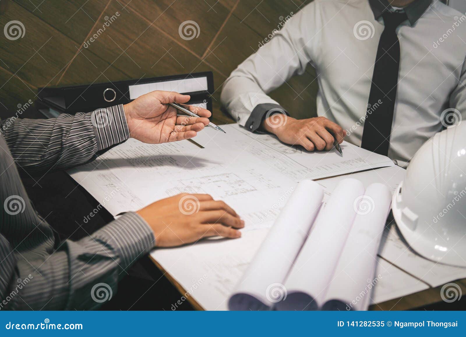 Construction Engineering or Architect Discuss a Blueprint while ...