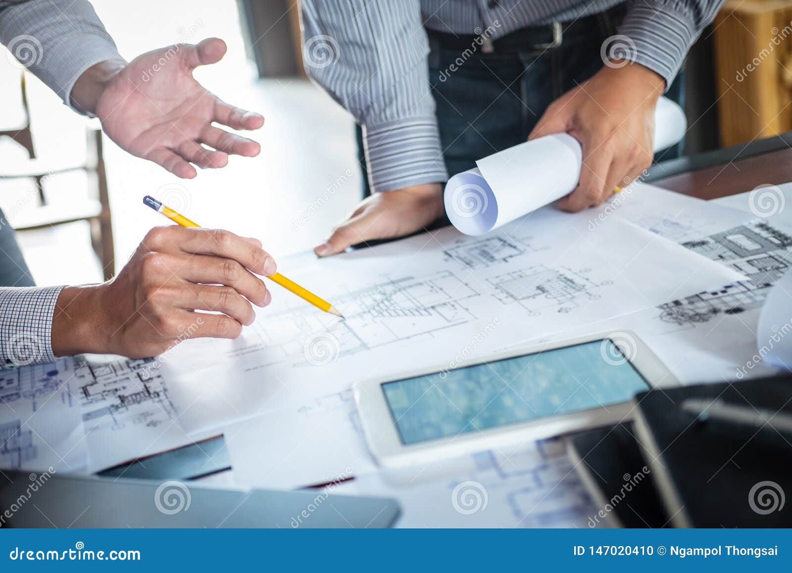 Construction Engineering or Architect Discuss a Blueprint while ...