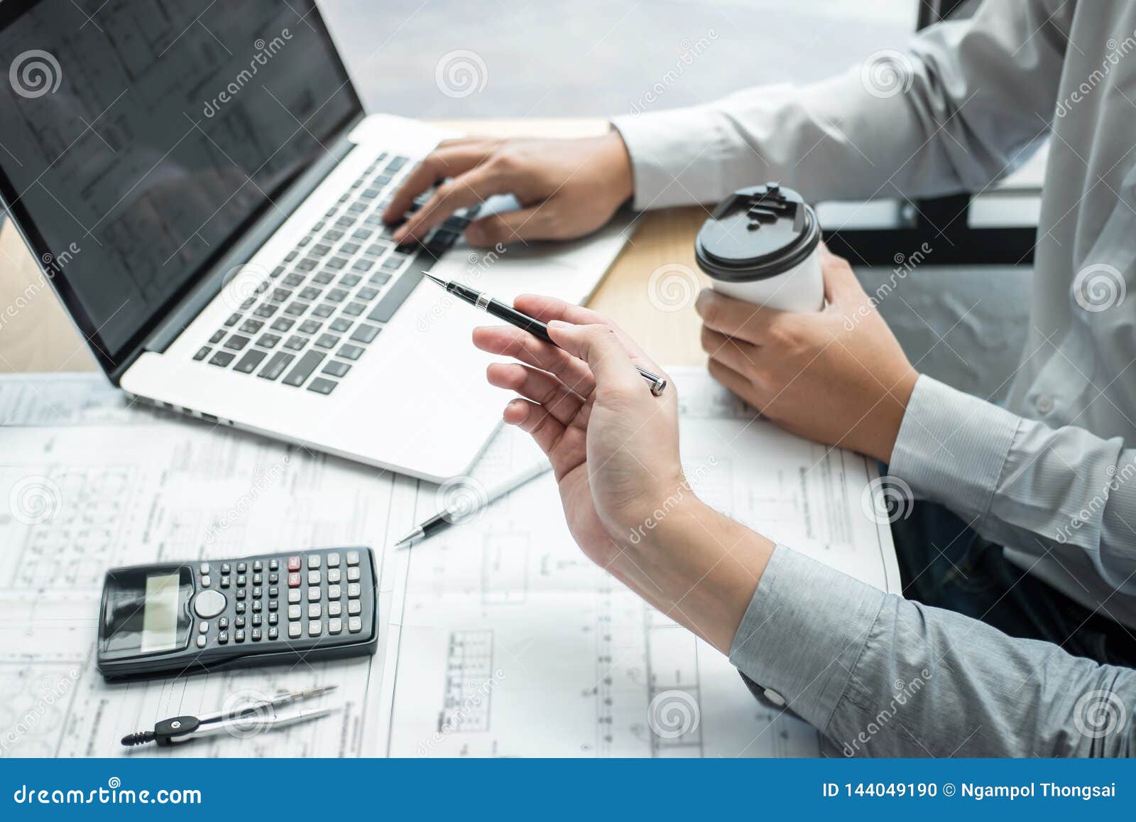 Construction Engineering or Architect Discussing a Blueprint and ...