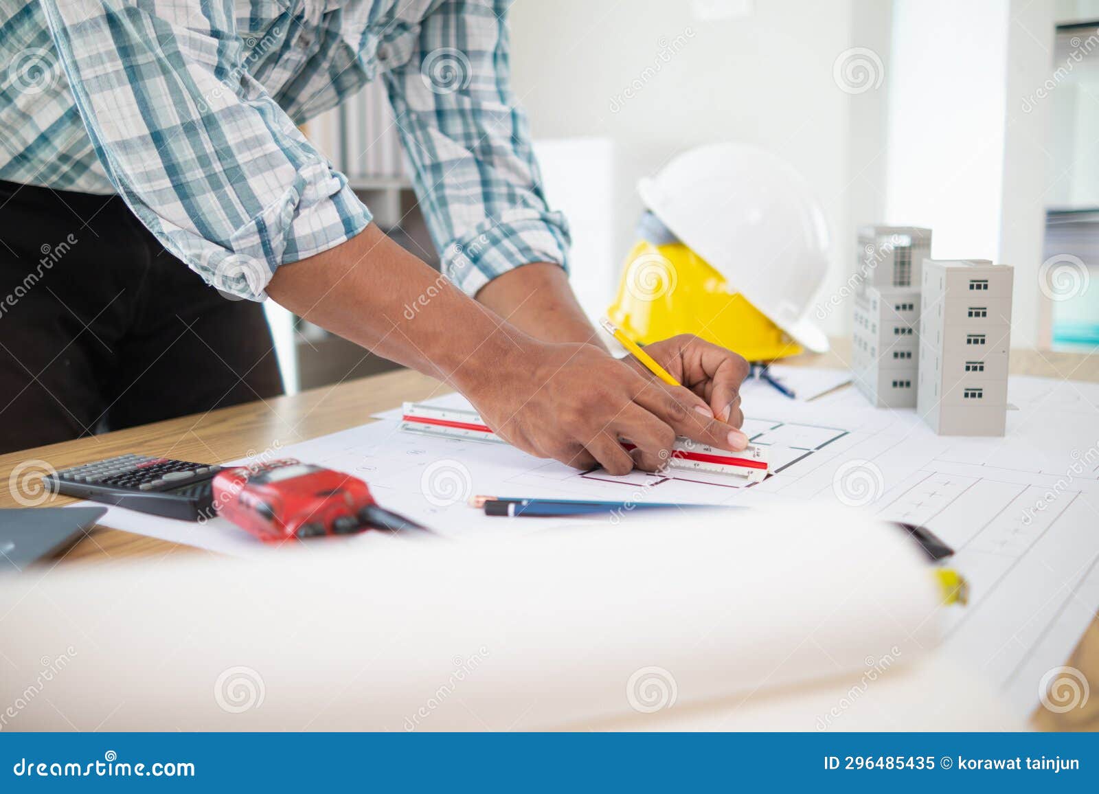 Construction Engineers are Checking Blueprints and Calculating Their ...