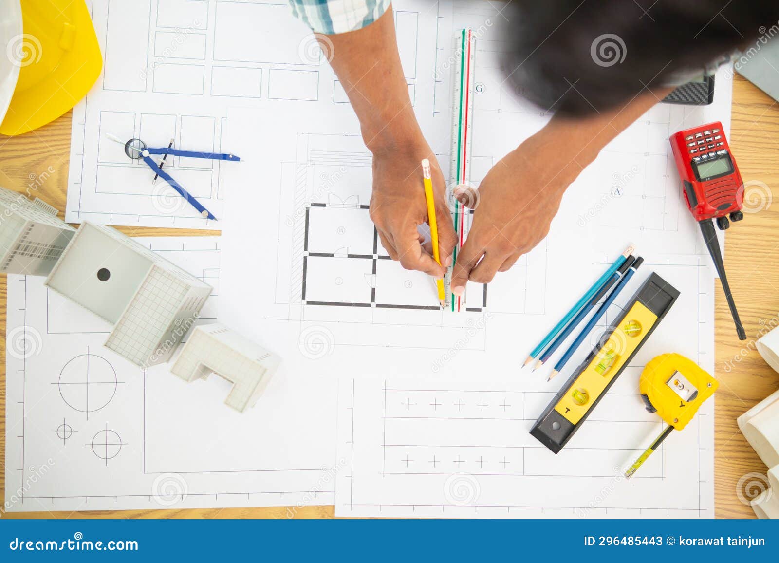 Construction Engineers are Checking Blueprints and Calculating Their ...