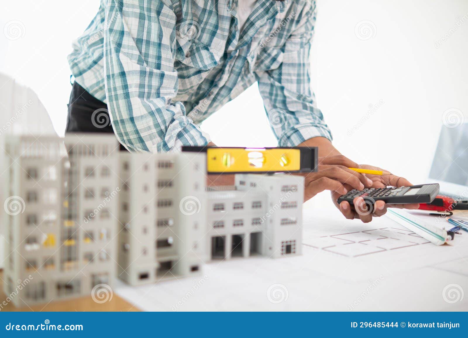 Construction Engineers are Checking Blueprints and Calculating Their ...