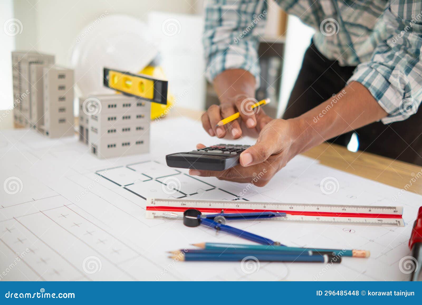 Construction Engineers are Checking Blueprints and Calculating Their ...