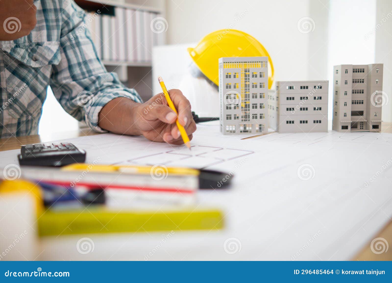 Construction Engineers are Checking Blueprints and Calculating Their ...