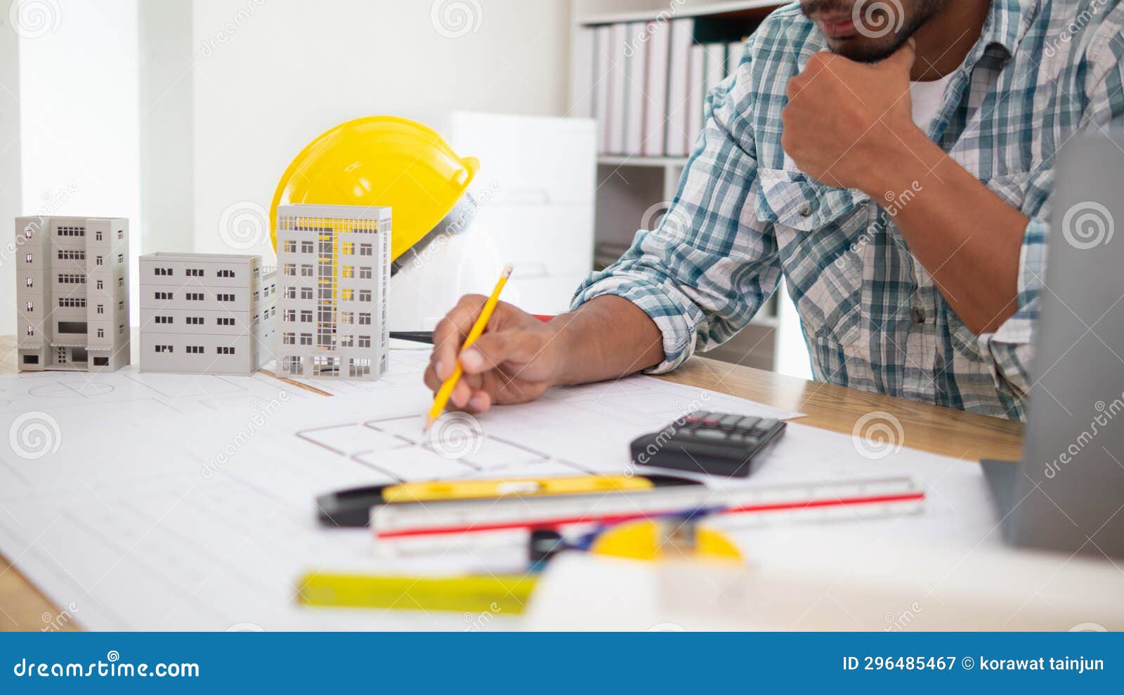 Construction Engineers are Checking Blueprints and Calculating Their ...