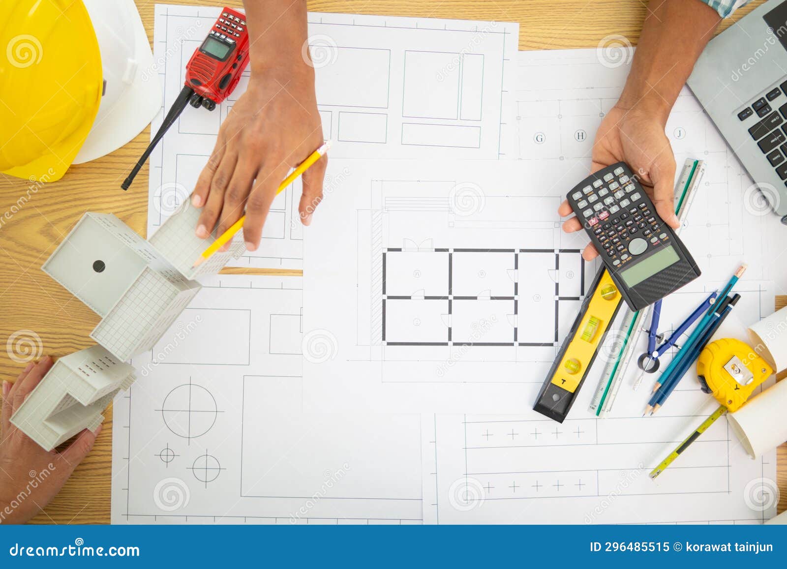 Construction Engineers are Checking Blueprints and Calculating Their ...