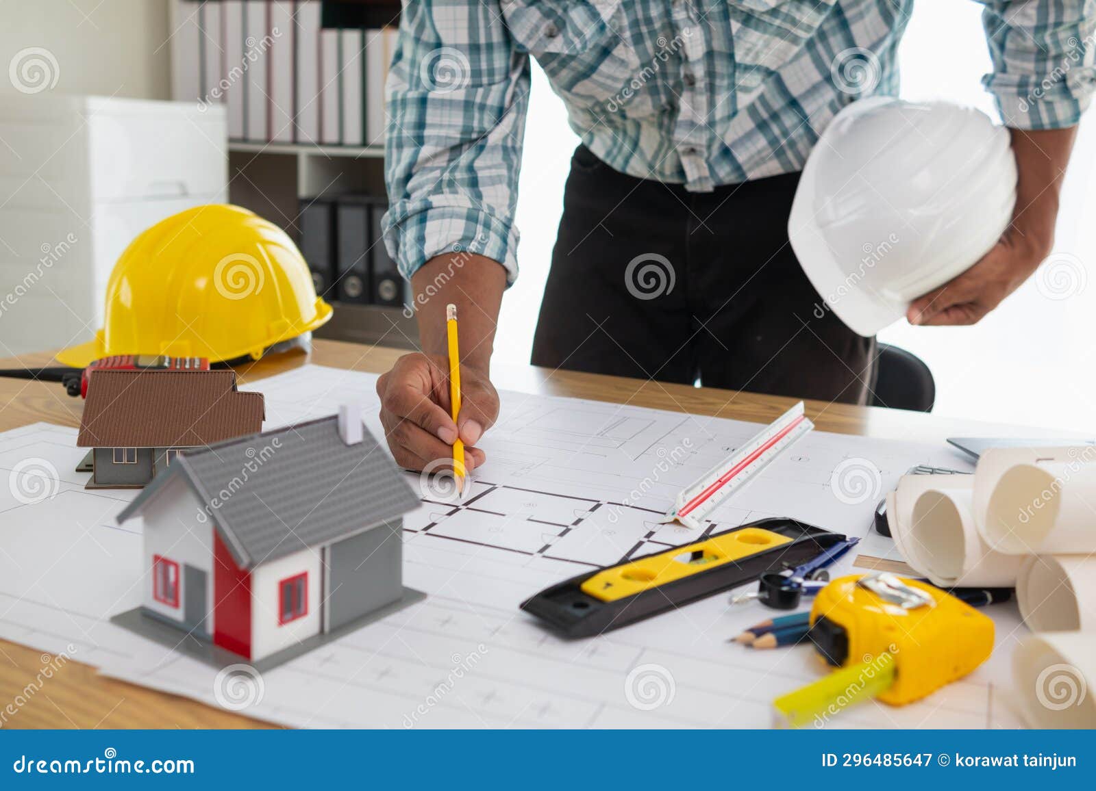 Construction Engineers are Checking Blueprints and Calculating Their ...