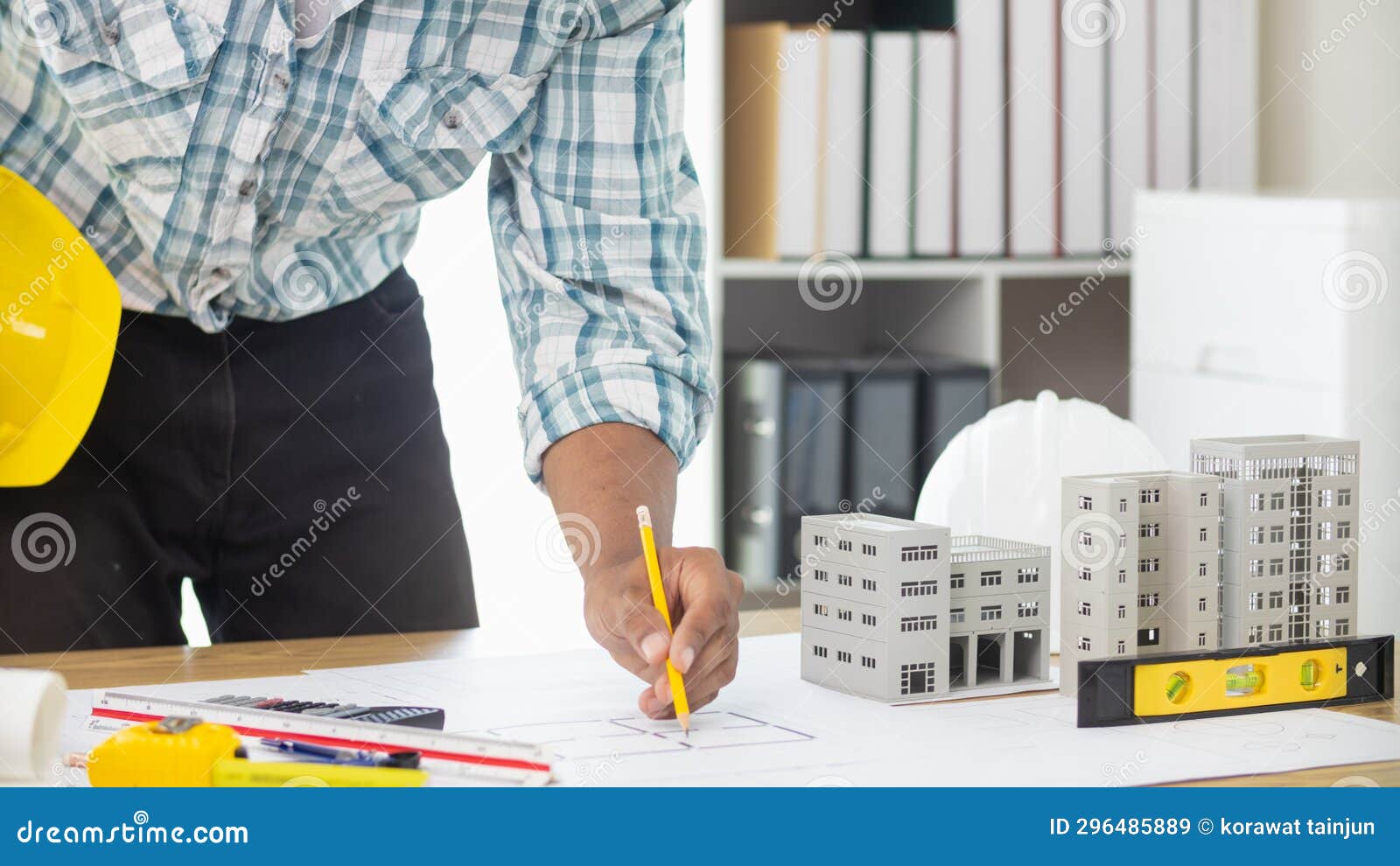 Construction Engineers are Checking Blueprints and Calculating Their ...