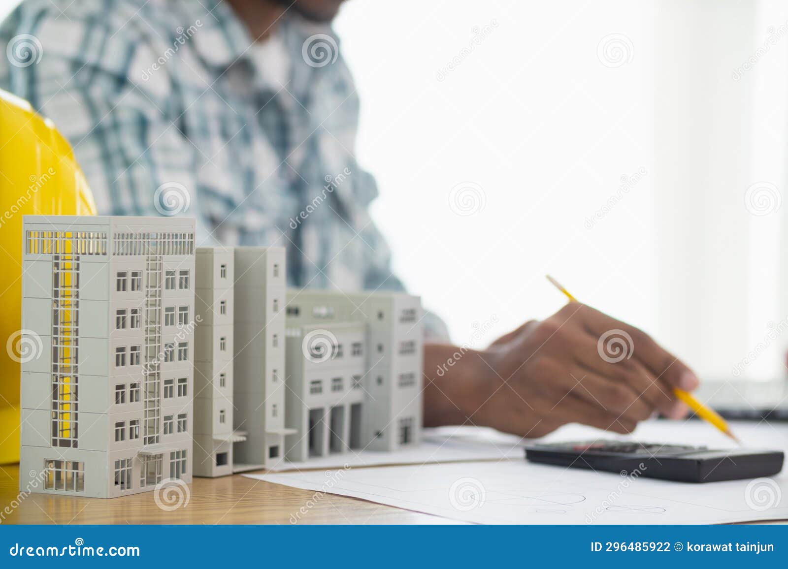 Construction Engineers are Checking Blueprints and Calculating Their ...
