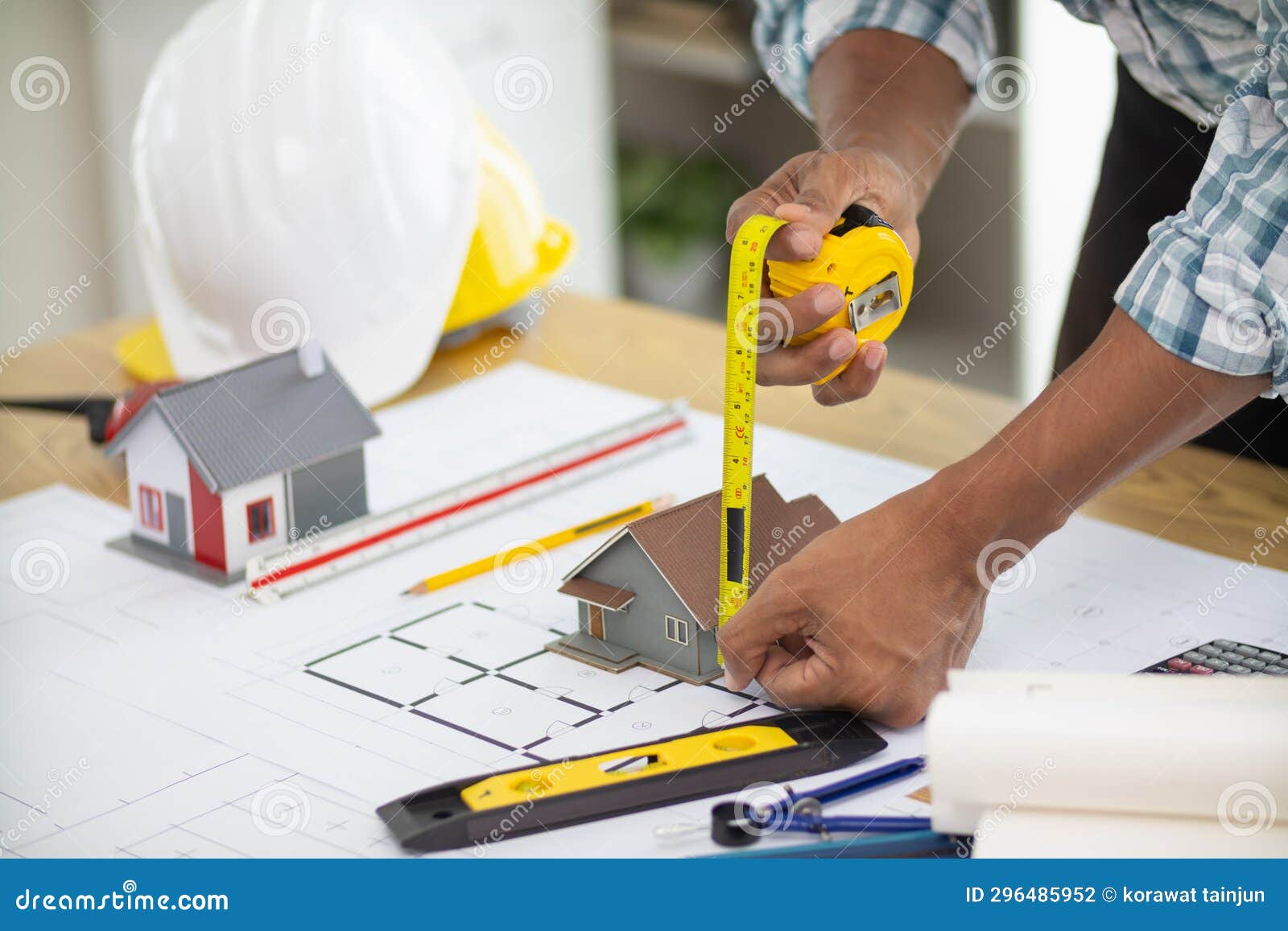 Construction Engineers are Checking Blueprints and Calculating Their ...