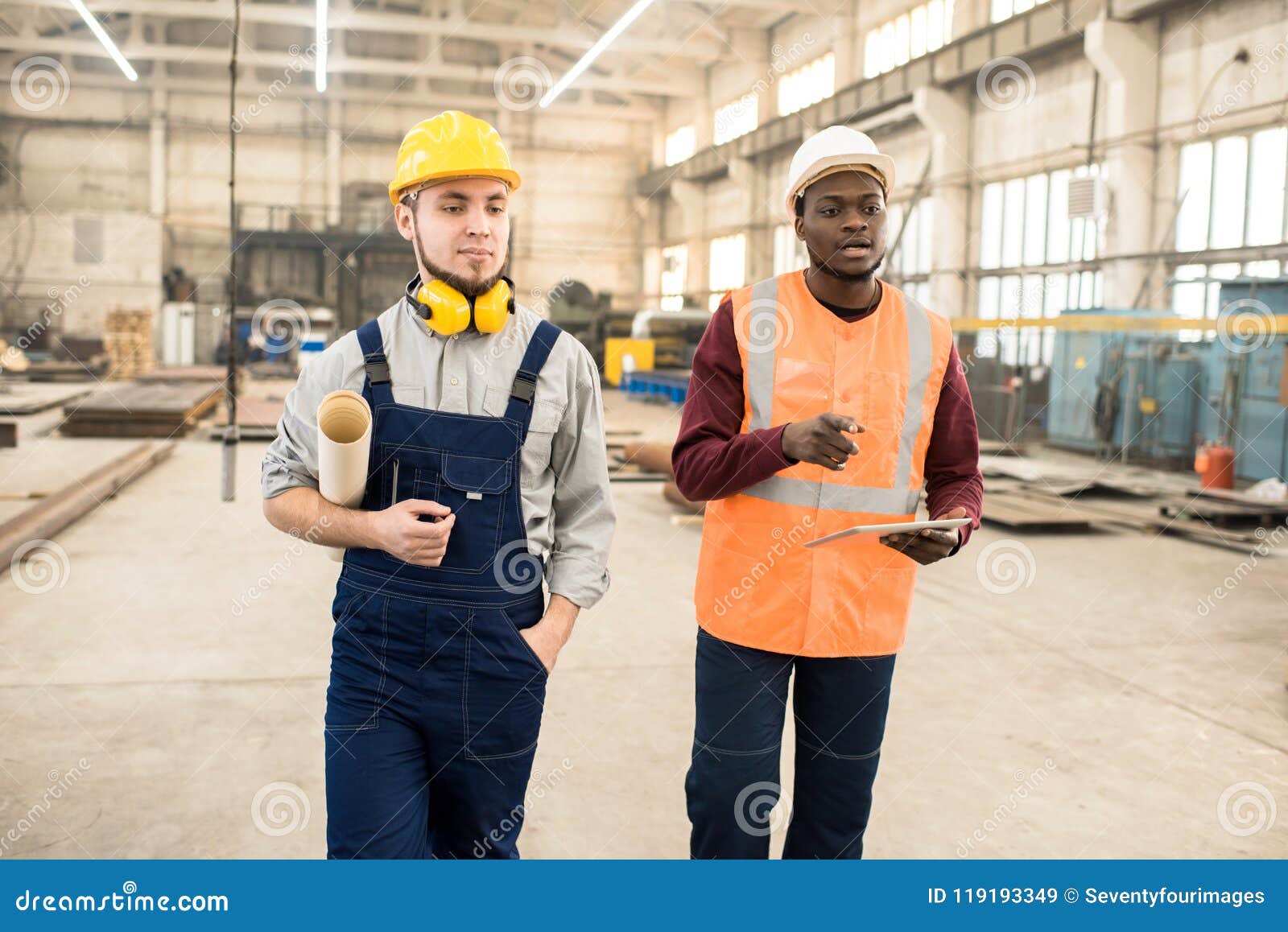Construction Engineers Discussing Building Plan Stock Image - Image of ...