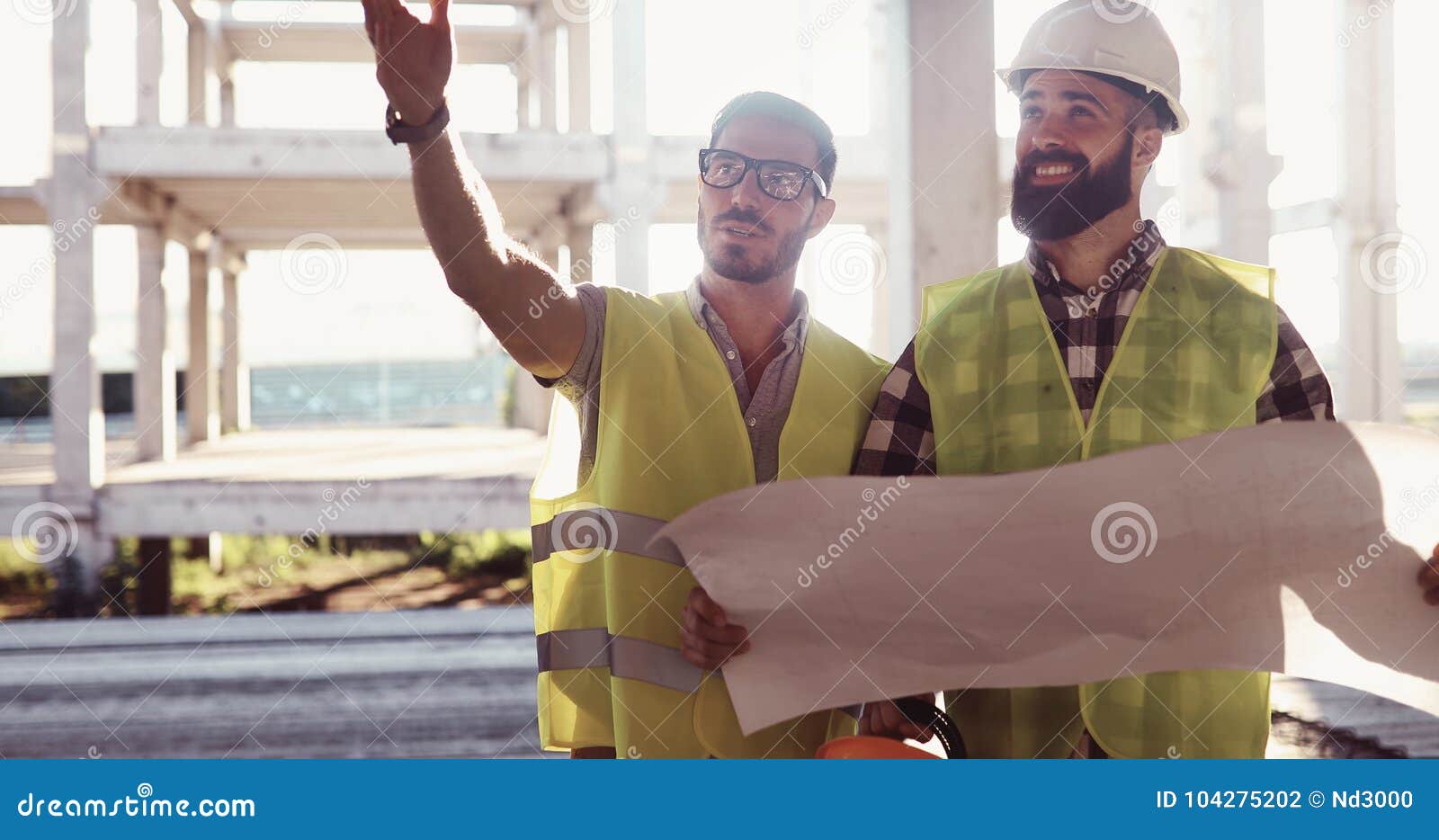 Construction Engineers Discussion with Architects at Construction Site ...