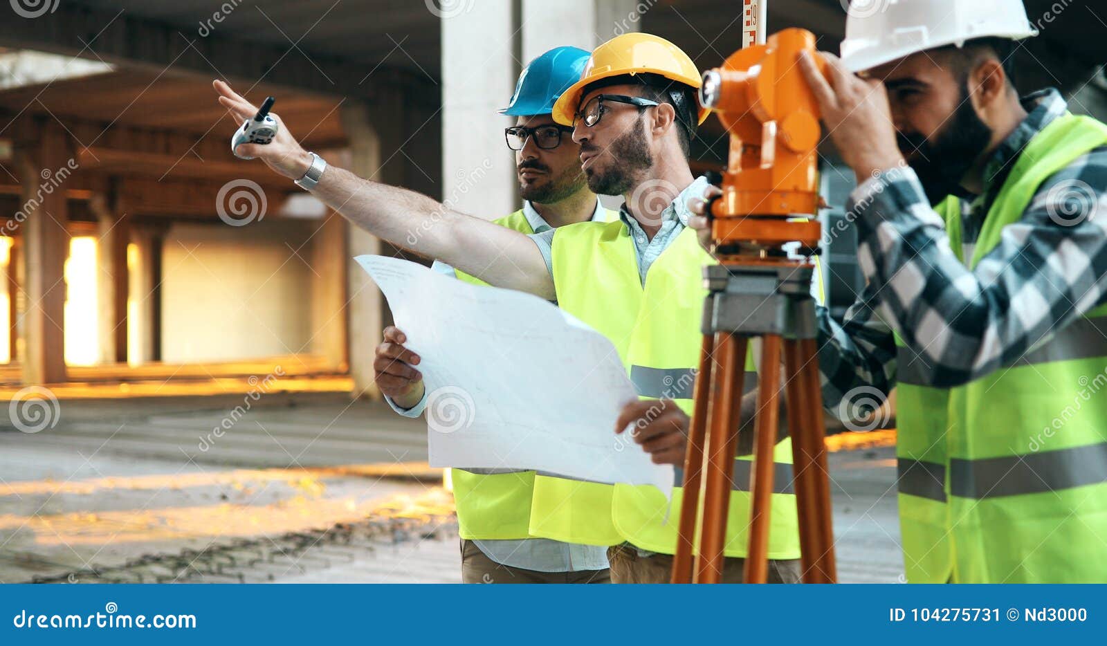 Construction Engineers Discussion with Architects at Construction Site ...