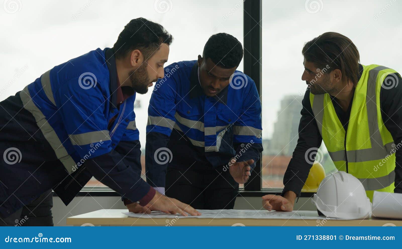 Construction Engineers Team Using Blueprint of Project Plan ...