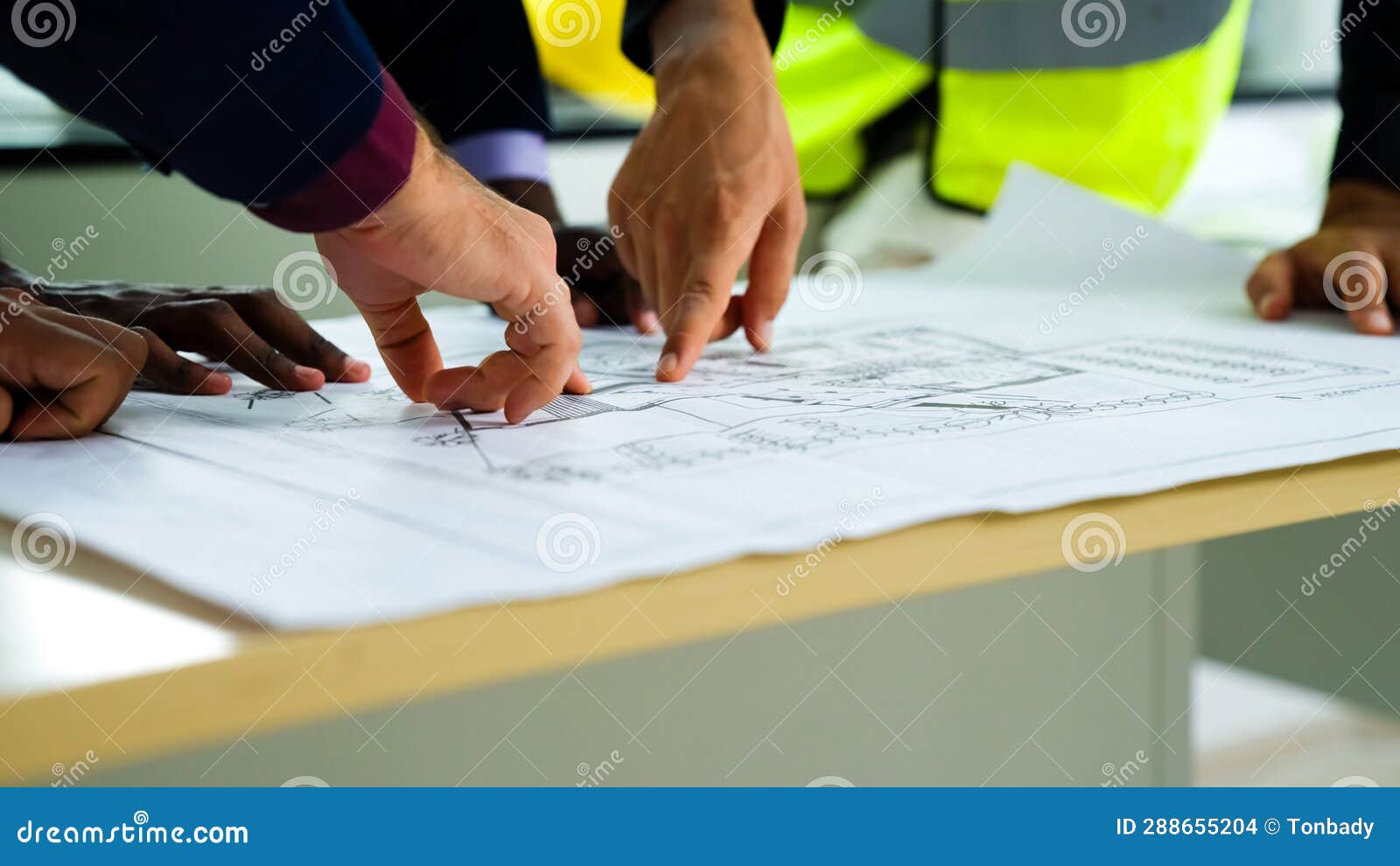 Construction Engineers Team Using Blueprint of Project Plan ...