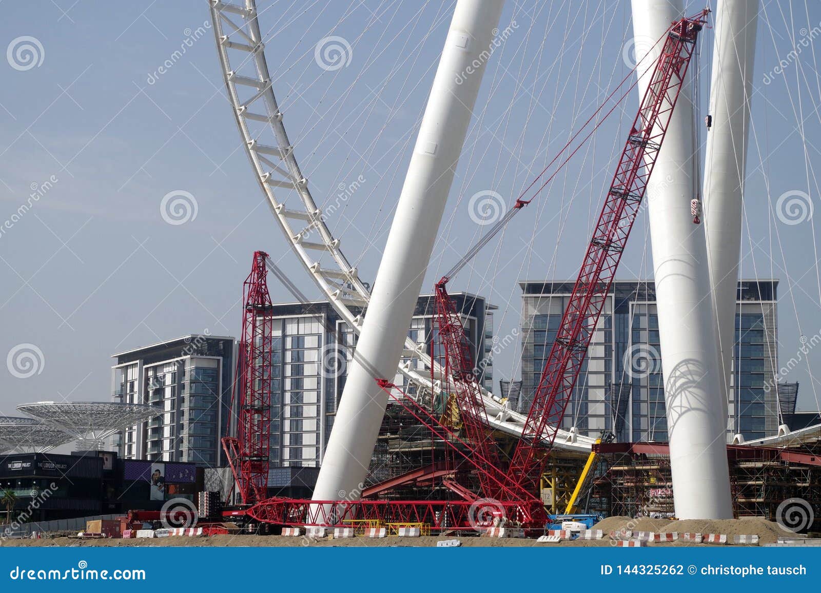 Construction Equipment at the Base of a Spectacular Ferris Wheel ...