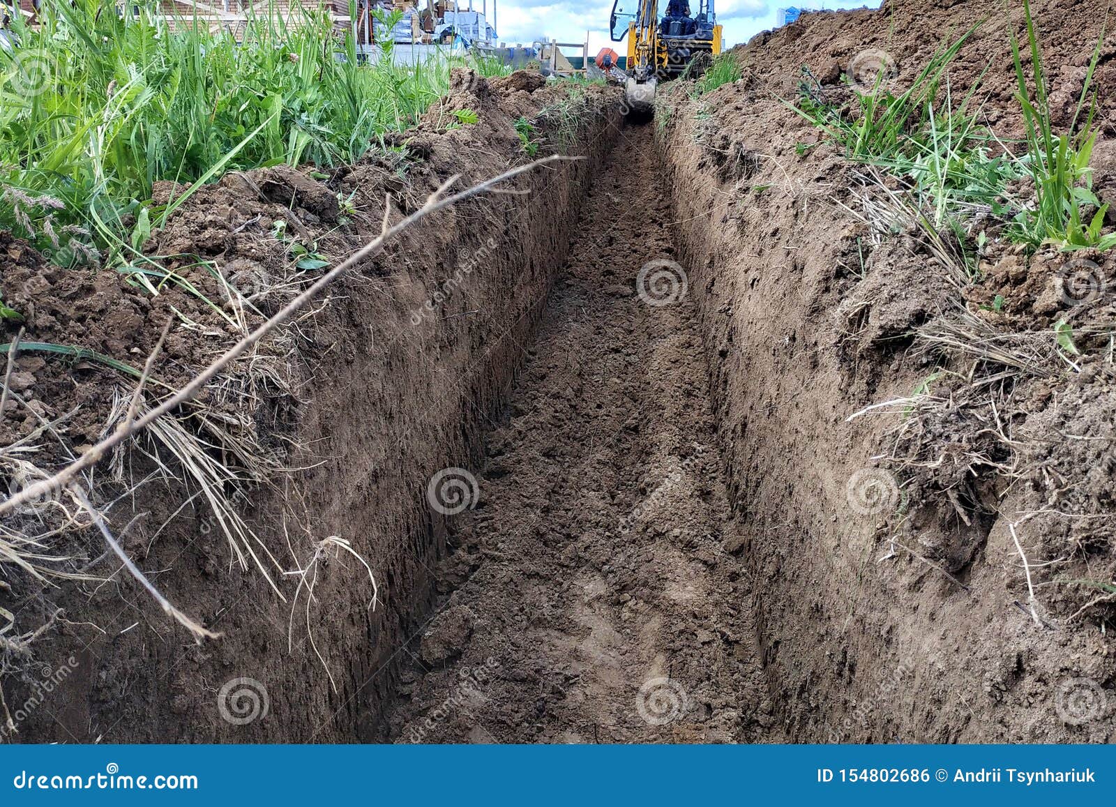 Construction Excavator Digging a Shallow Groove for Electrical Wiring ...