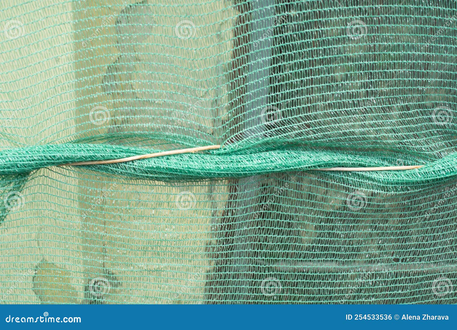 The Construction Facade Mesh is Sewn Together. Construction Works in ...
