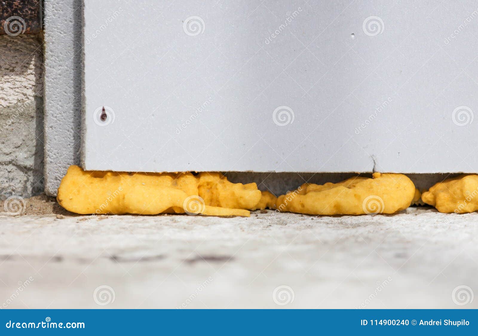 Construction Foam in the Wall Slit As a Background Stock Photo - Image ...