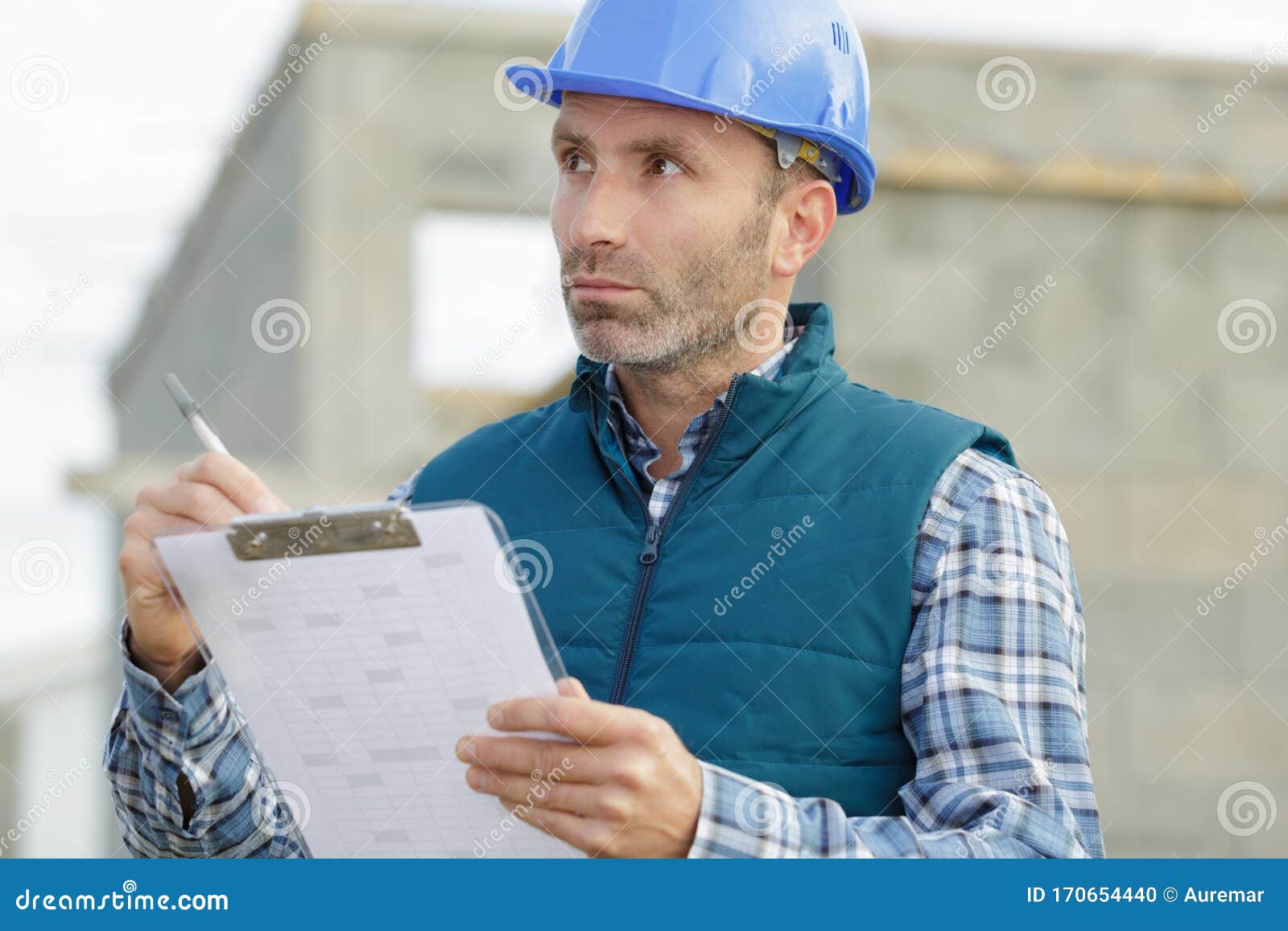 Construction Foreman Builder Writing on Clipboard Stock Photo - Image ...