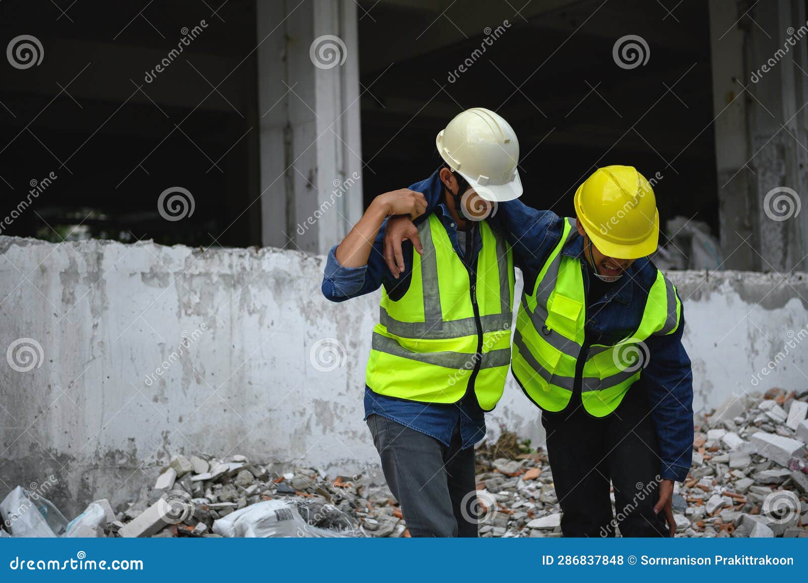 Construction Foreman Helping To Support the Body of Builder Workers ...