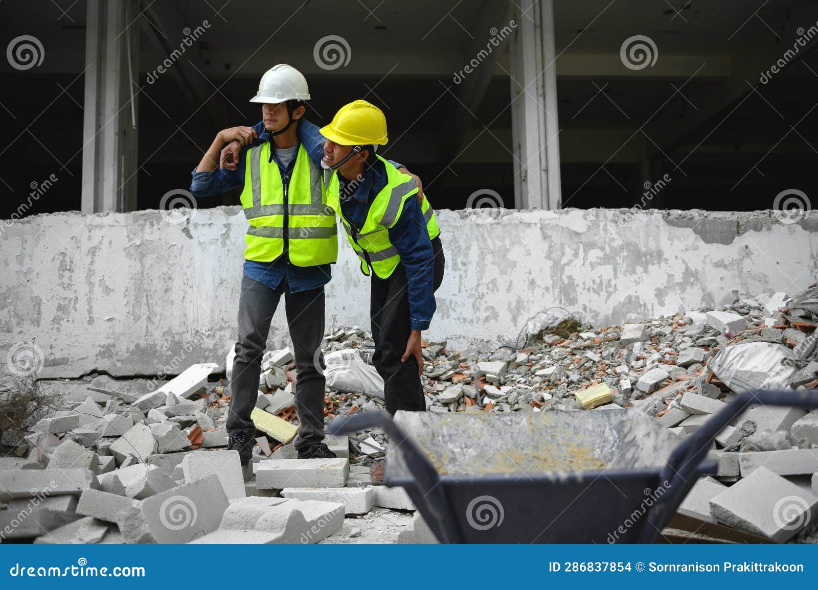 Construction Foreman Helping To Support the Body of Builder Workers ...