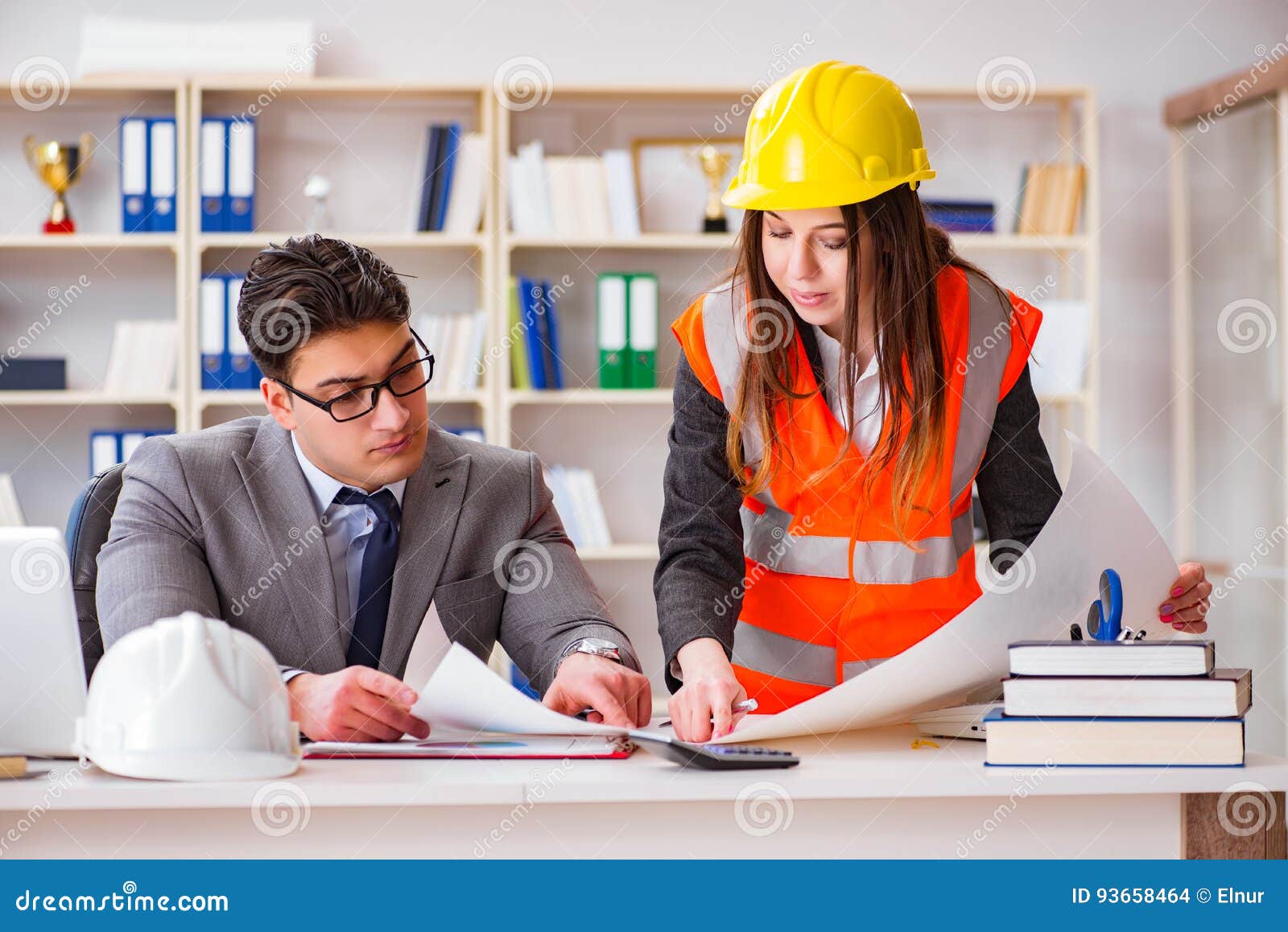 The Construction Foreman Supervisor Reviewing Drawings Stock Photo ...