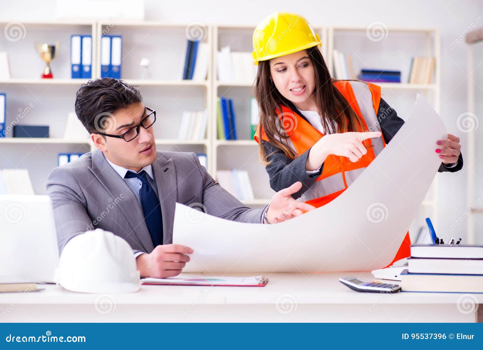 The Construction Foreman Supervisor Reviewing Drawings Stock Photo ...