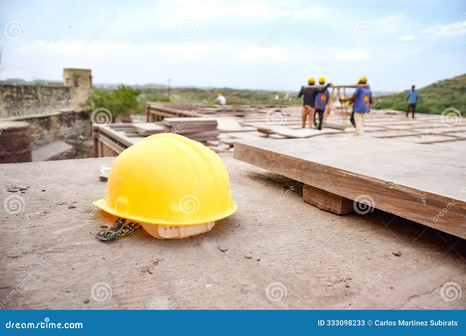 Construction Helmet Posed with Background of Workers Showing Leadership ...