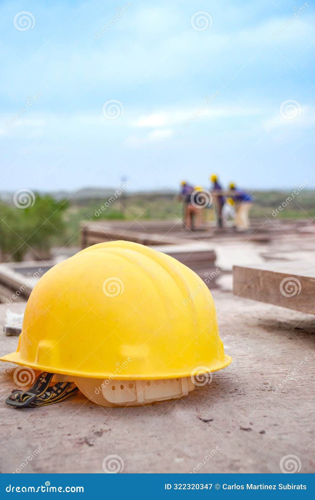 Construction Helmet Posed with Background of Workers Showing Leadership ...