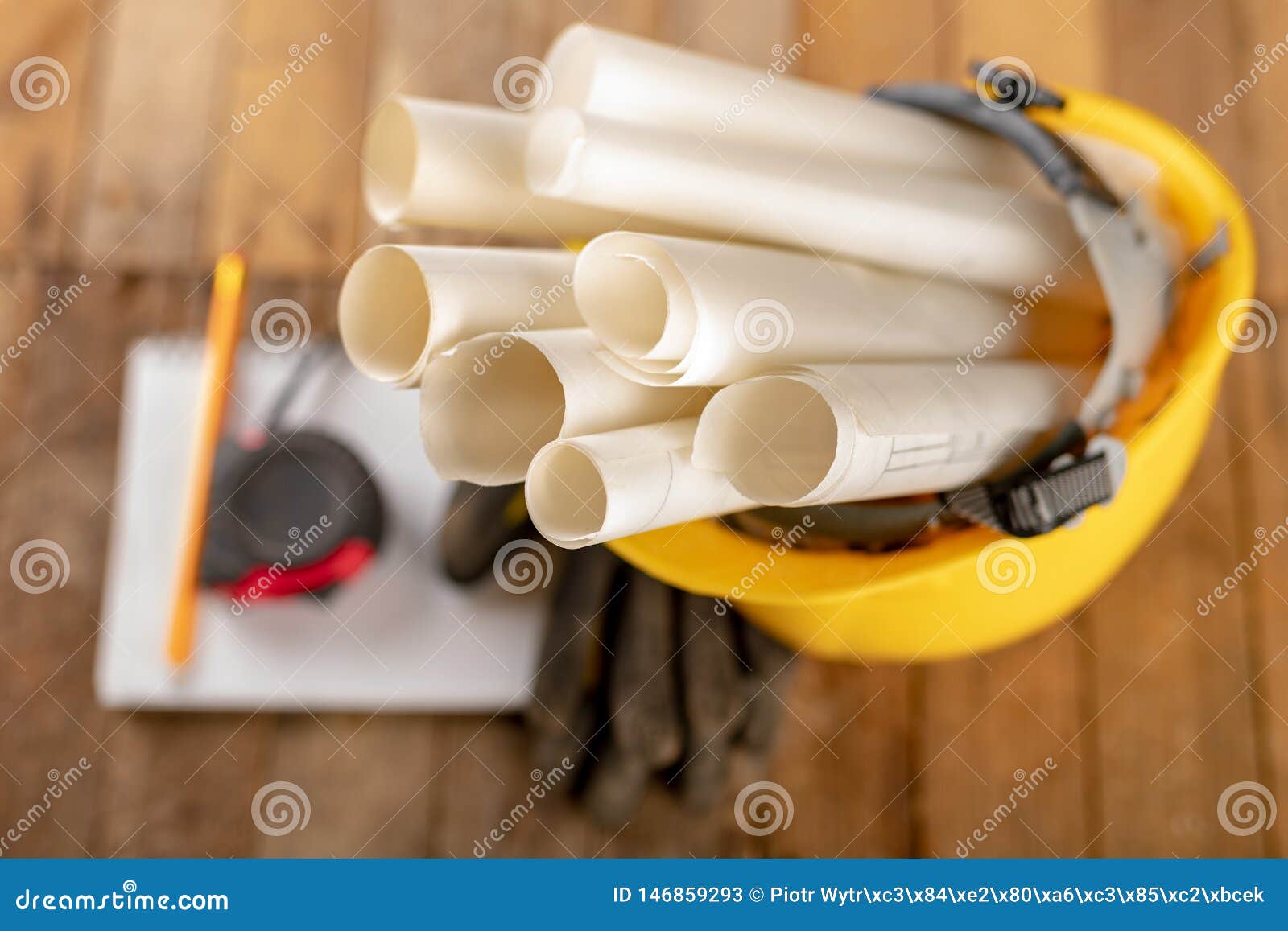 Construction Helmet and Roll of Parchment with Design. Construction ...