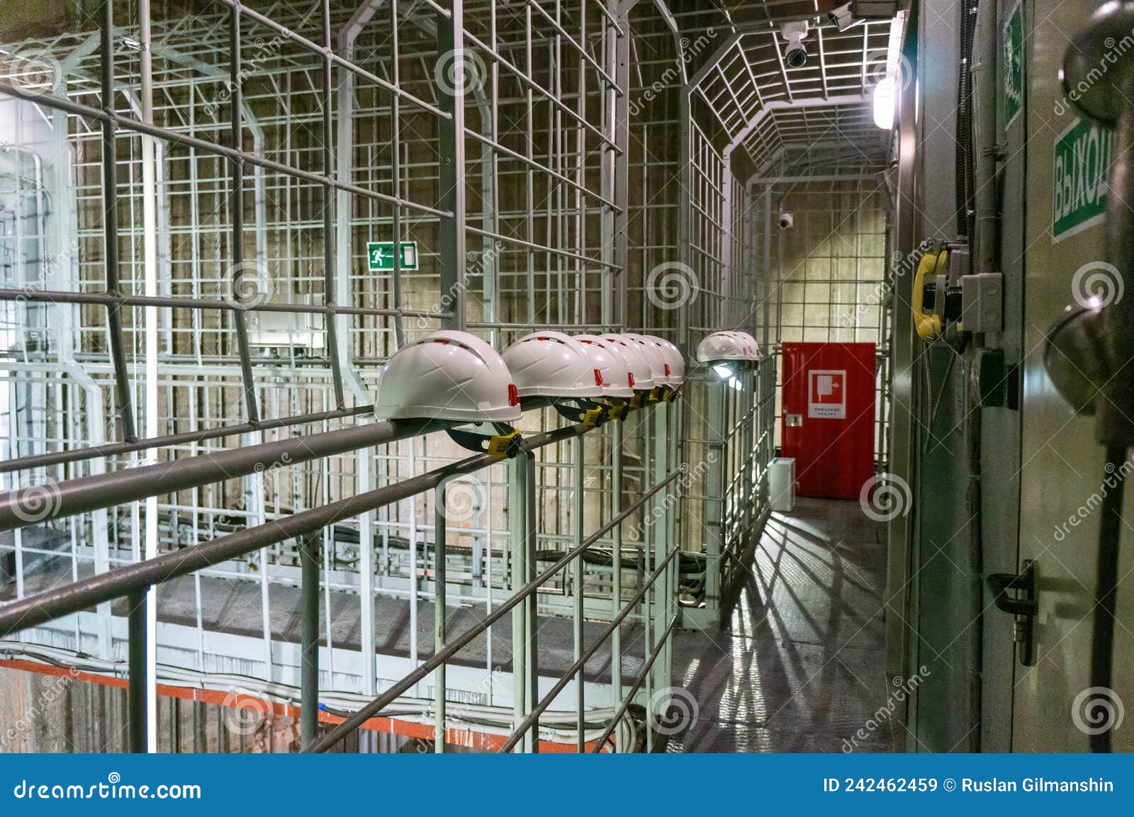 Construction Helmets Lie on a Shelf in the Factory Locker Room. Safety ...