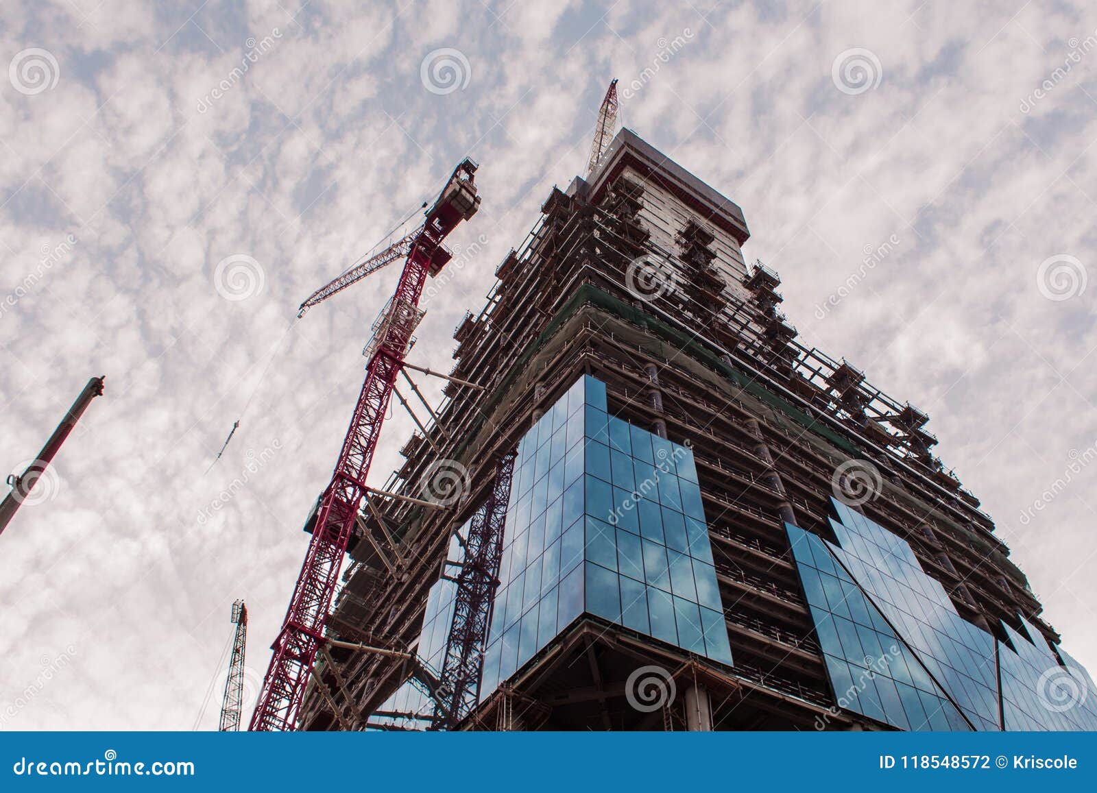 Construction of High-rise Building. Construction Cranes and Skyscraper ...