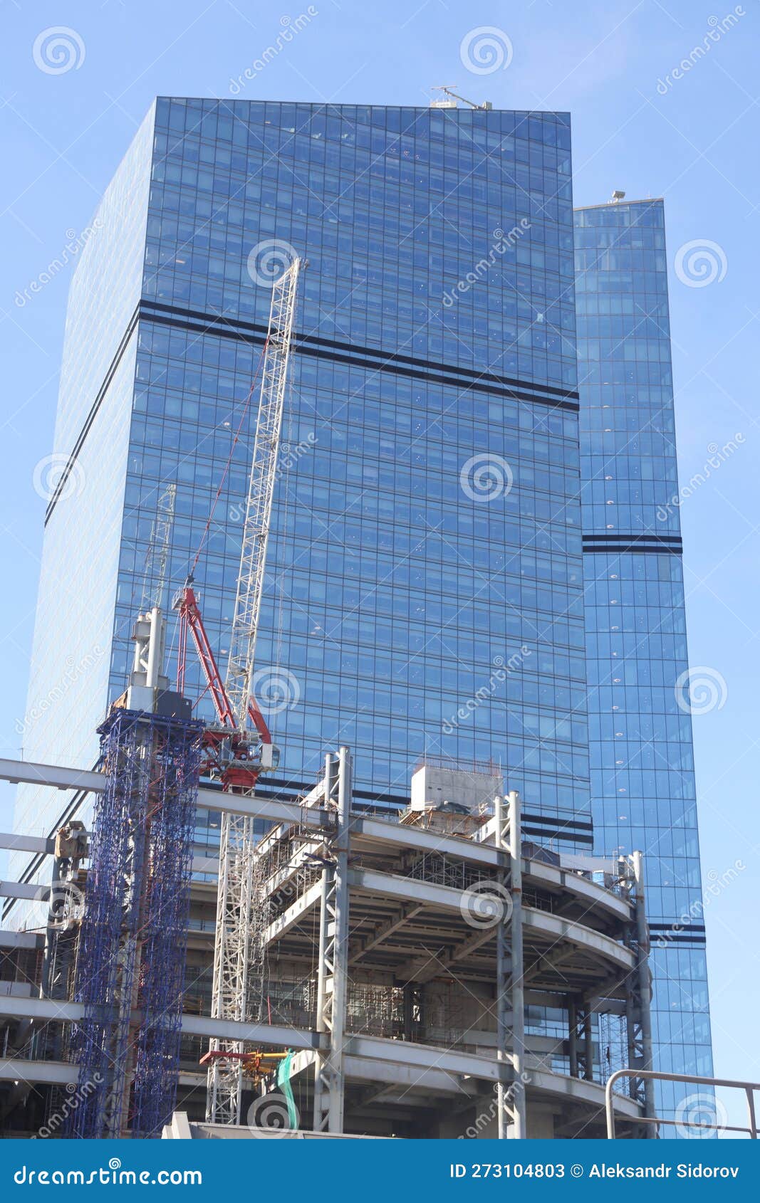 Construction of a High Rise Building with a Crane in the Background ...