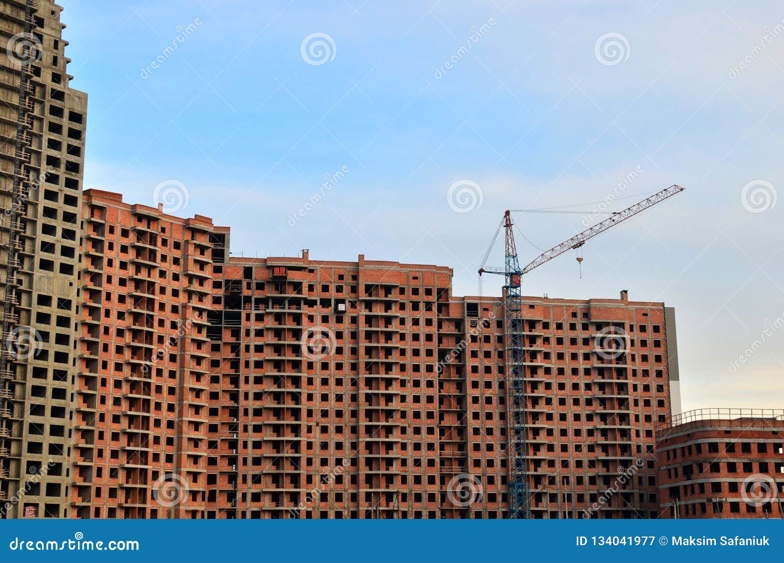 Construction of a High-rise Building with a Crane. the Construction ...