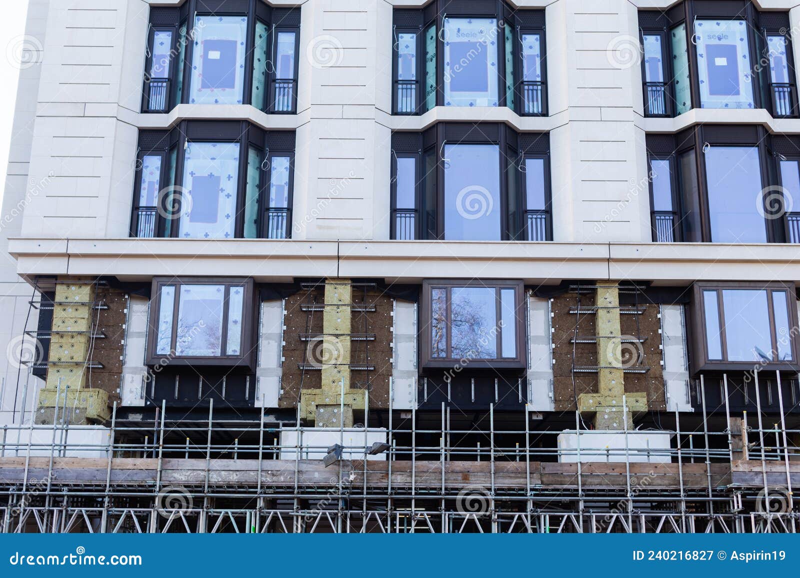 Construction of High-rise Building. Installing Curtain Wall on the ...