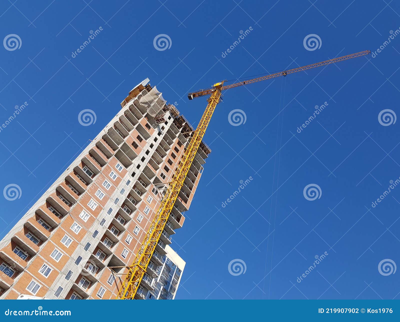 Construction of a High-rise Building with a Tower Crane Stock Photo ...