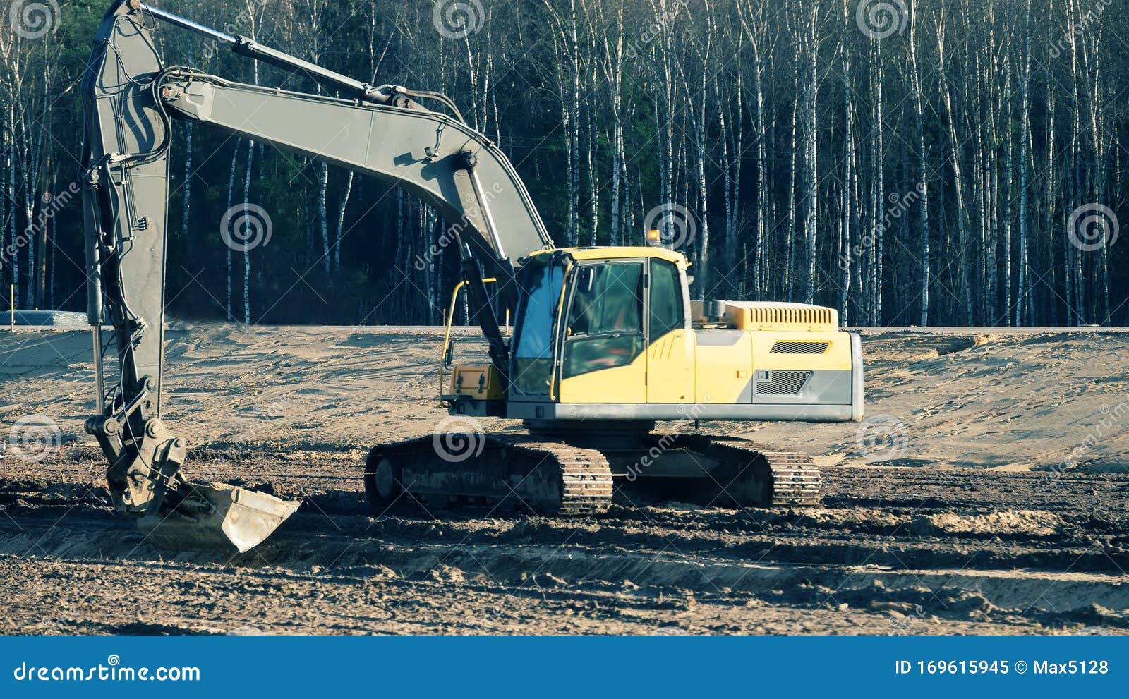 Excavator in the Process of Leveling the Slope of the Road Stock Image ...