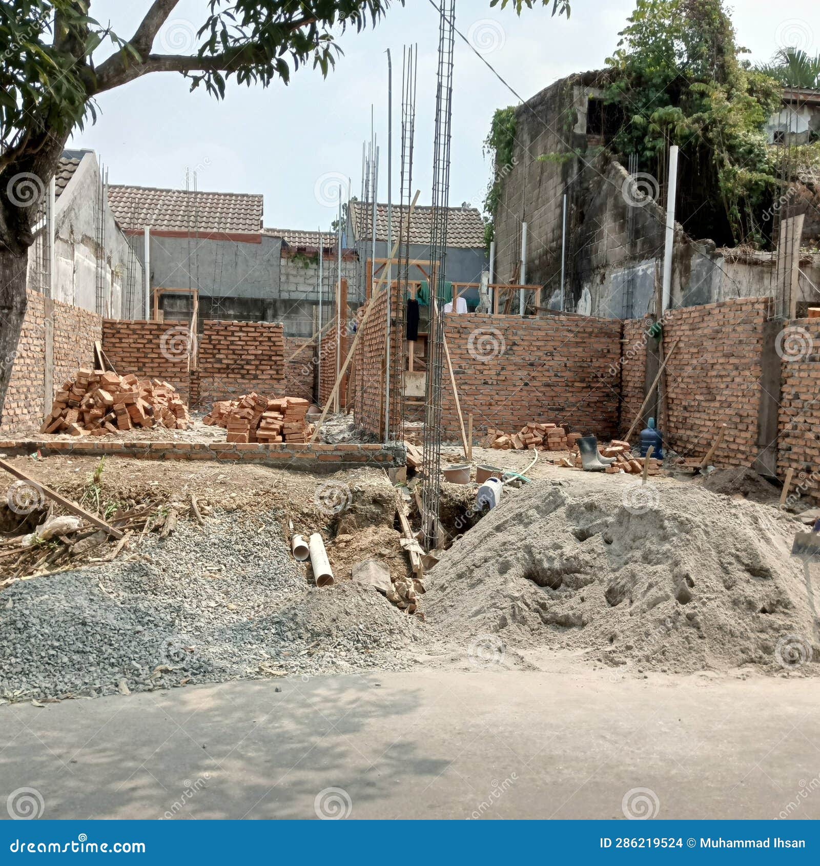 Construction of Houses Using Red Bricks, Gravel and Sand Stock Photo ...