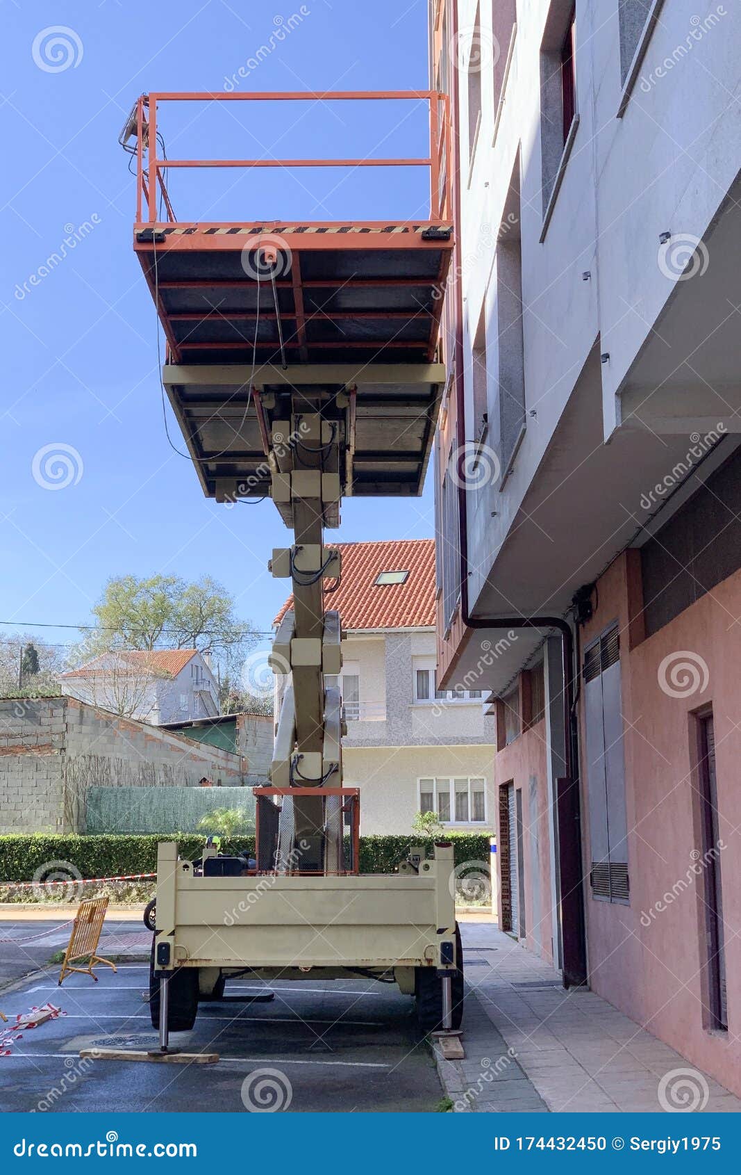 Construction Hydraulic Lift Near a Residential Building Stock Photo ...