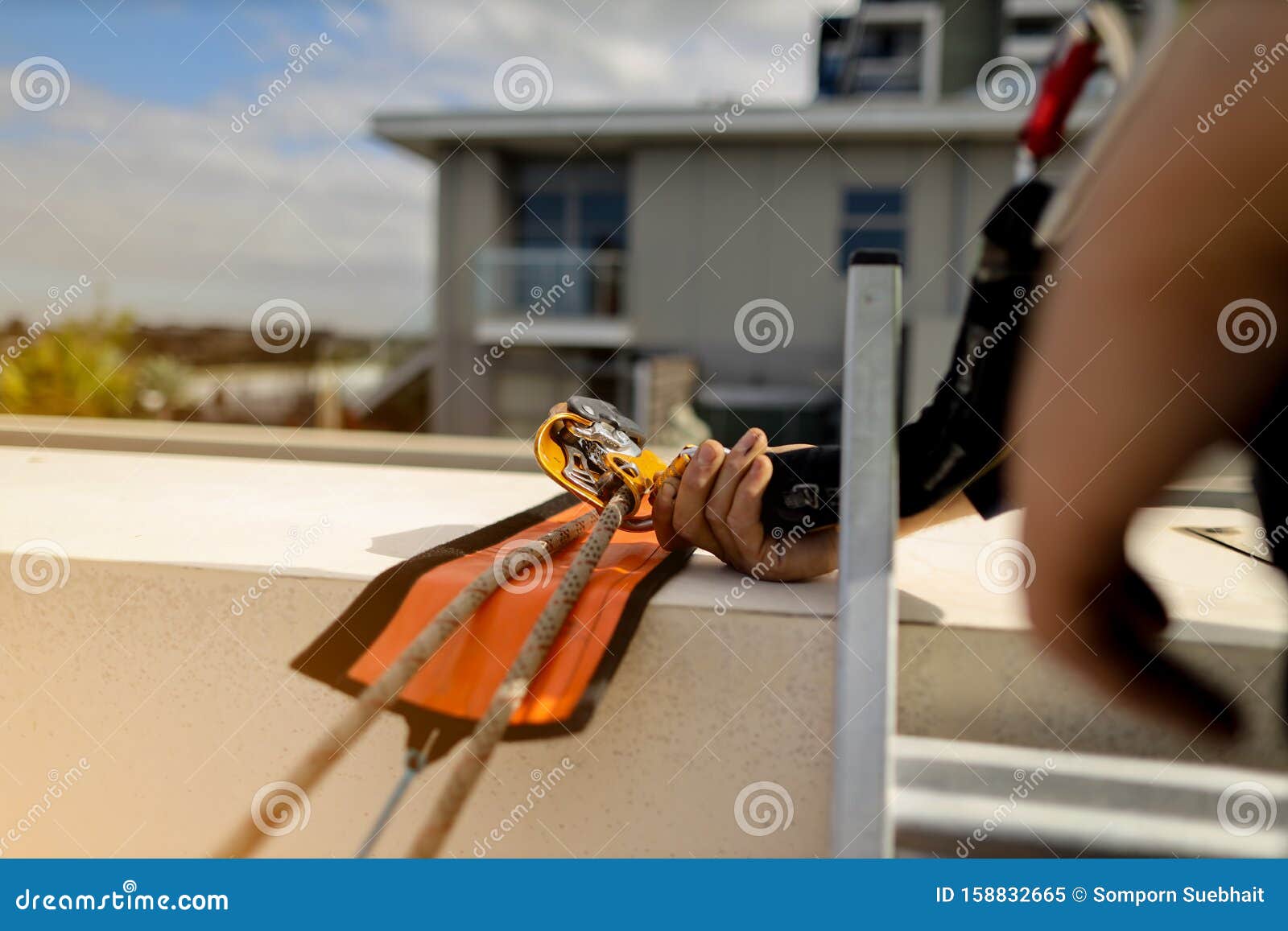 Industrial Rope Access Abseiler Window Cleaner Worker Bend Knees While ...