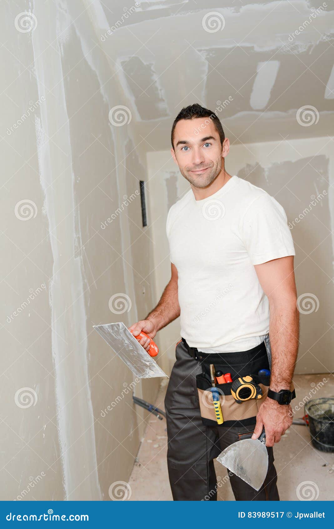 Construction Industry Worker with Tools Plastering Walls and Renovating ...