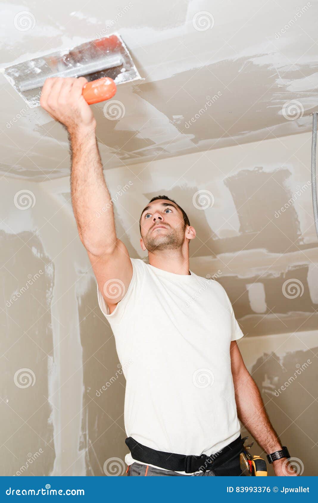 Man Plastering The Walls With Finishing Putty In The Room Royalty-Free ...