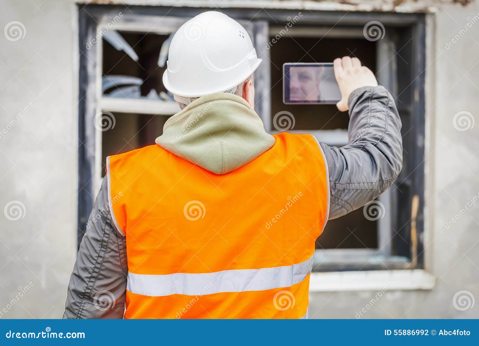 Construction Inspector Filming with Cell Phone Near Building Stock ...