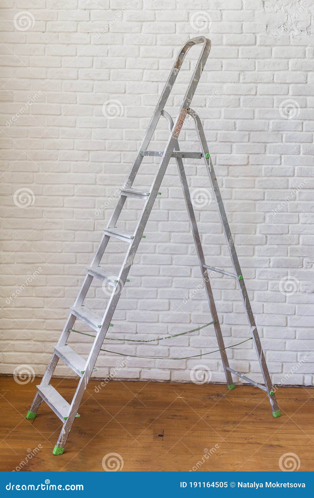 A Construction Ladder Stands on a Wooden Floor. Stock Image - Image of ...