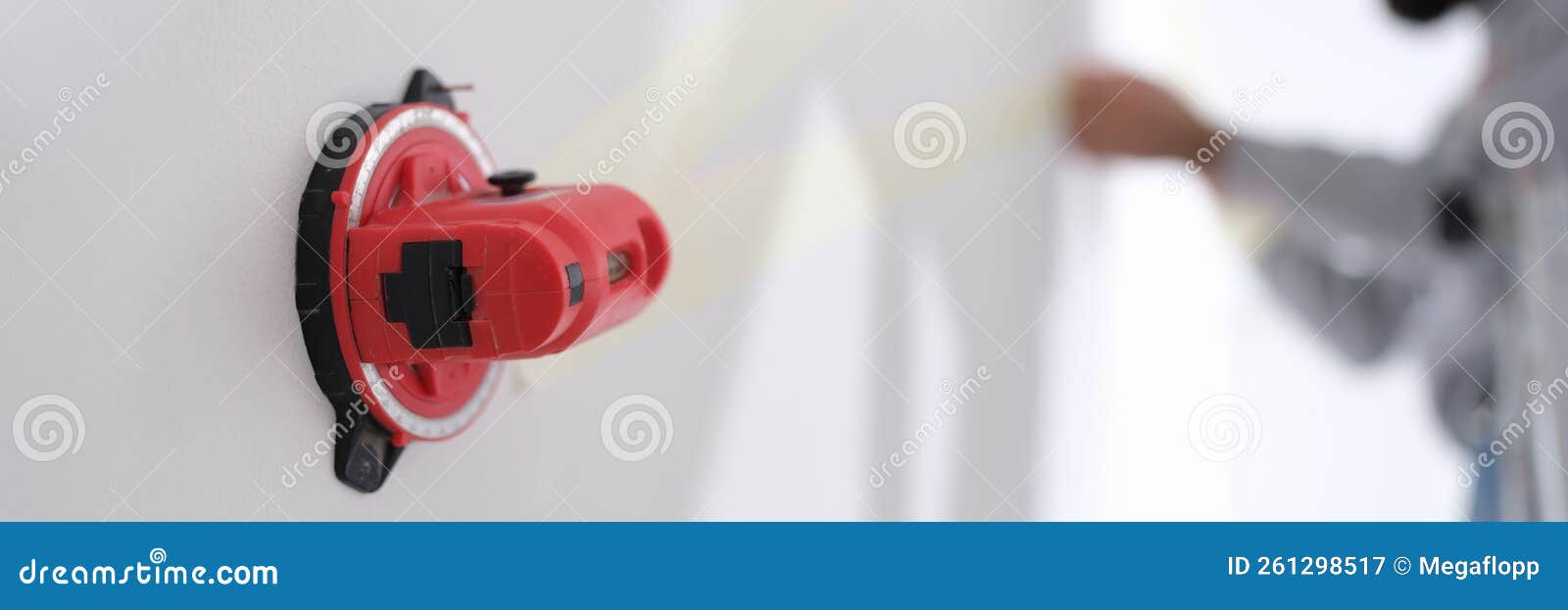 Construction Laser Level is Fixed on Wall. Builder Makes Repairs in ...