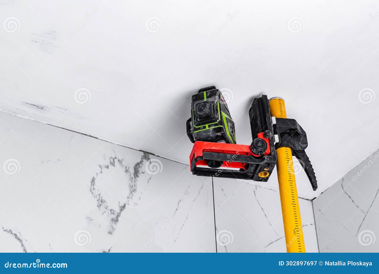 Construction Laser Level on Tripod on White Ceiling Background. Stock ...