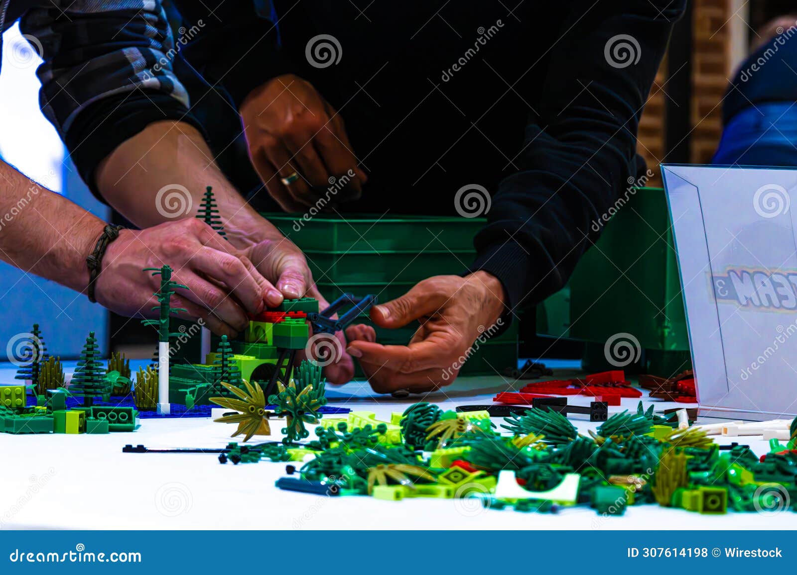 Construction with Lego Gathering Several People, Teamwork Editorial ...