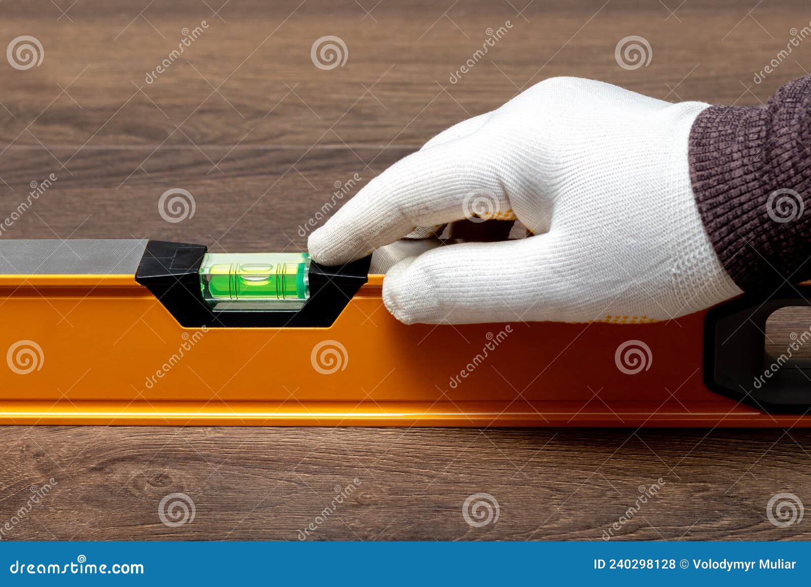 The Construction Level in the Carpenter`s Hand Checks the Level of the ...